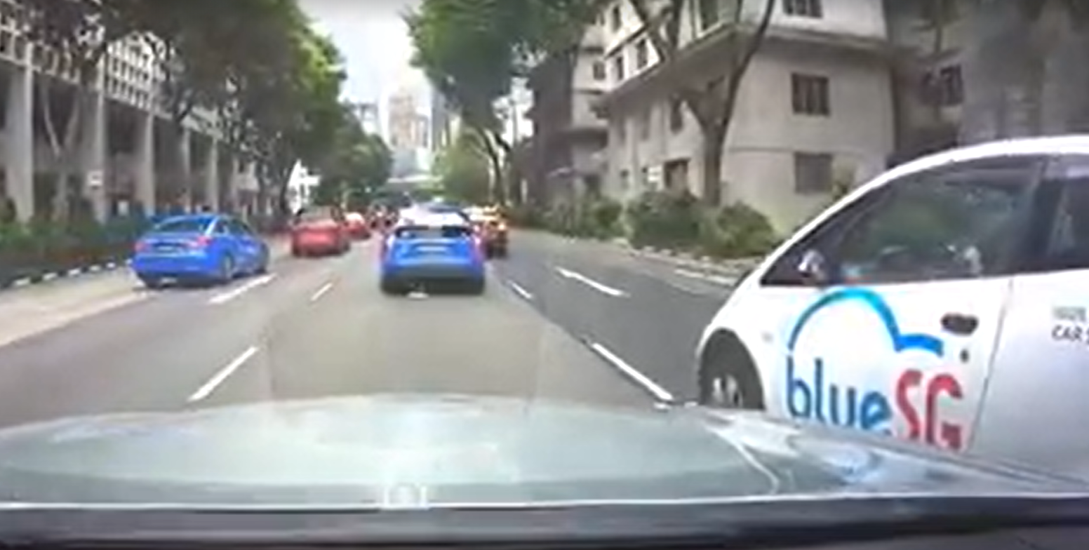 Driver of Blue SG changes lane without checking clear