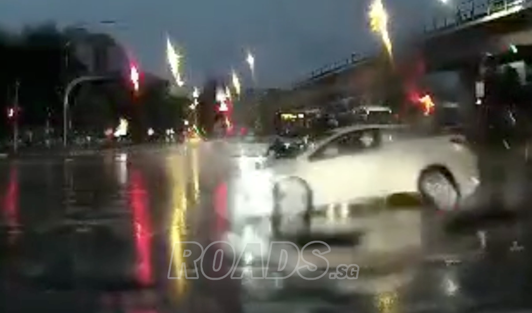 Motorcyclist makes right turn on red light and gets hit by car