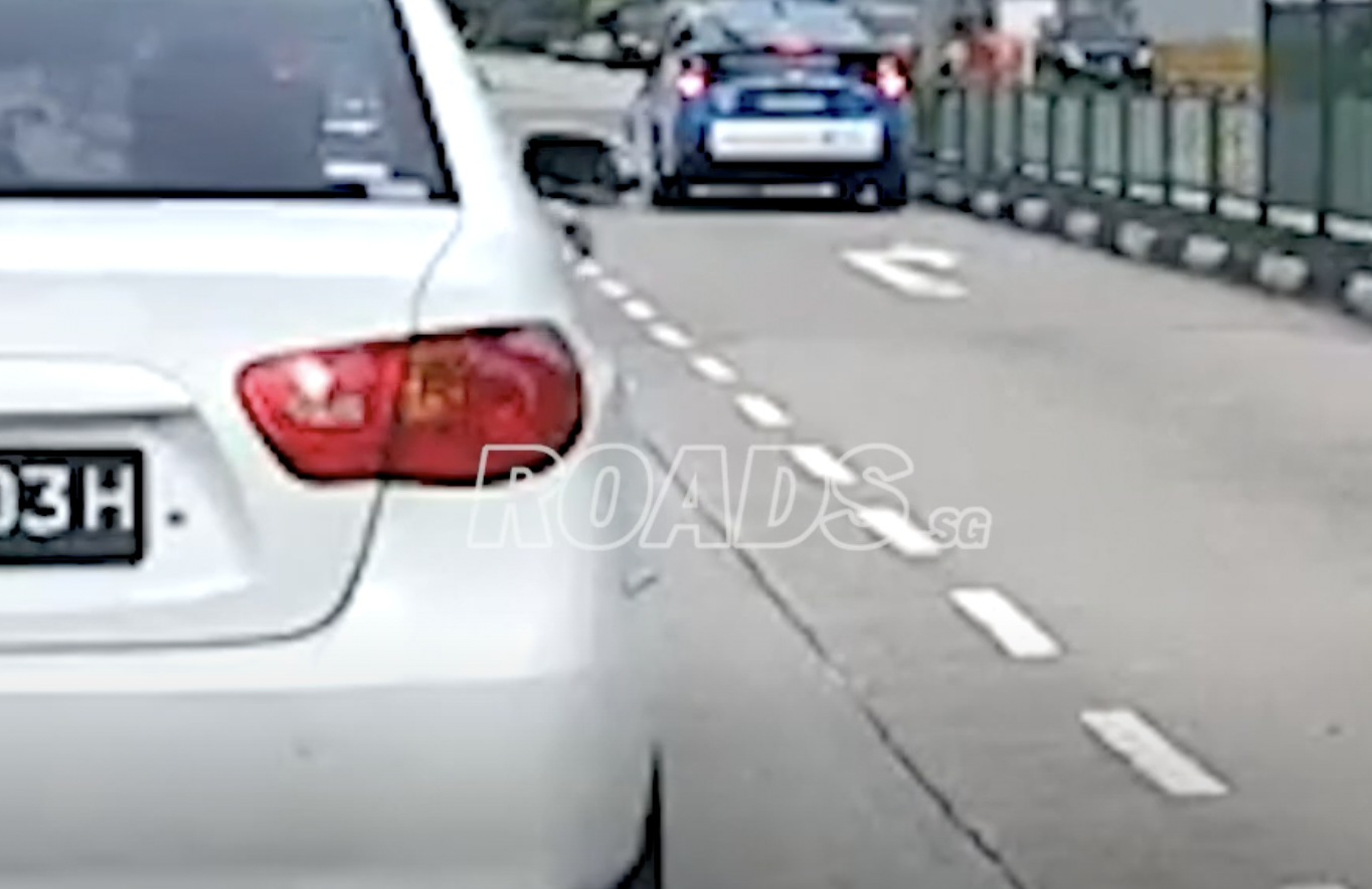 Driver of Hyundai Avante throws litter out of the car